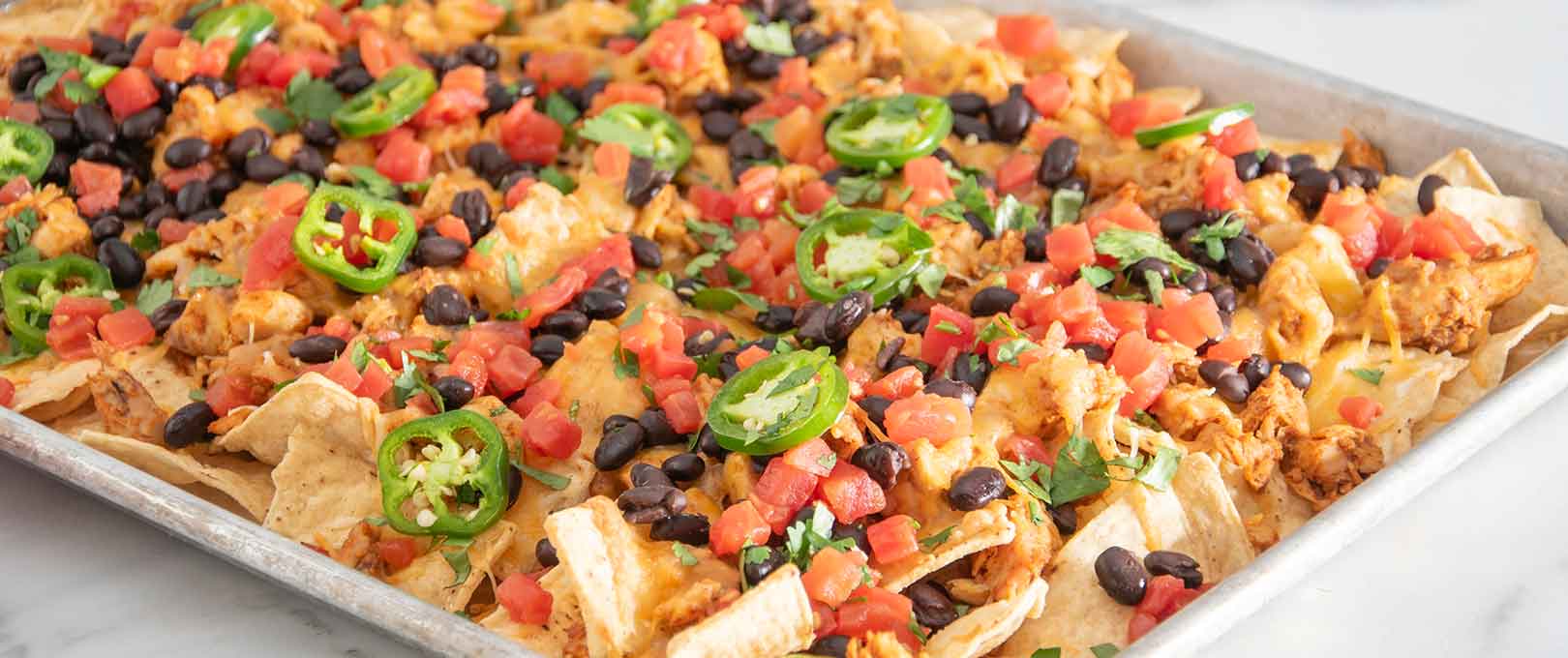 Loaded Chicken Nachos | Red Gold Tomatoes